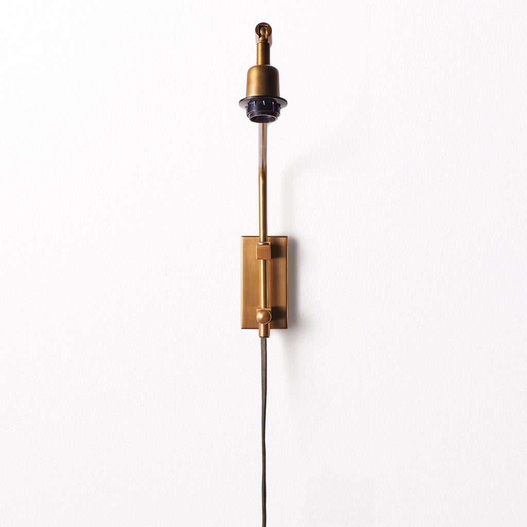 Carter Wall fixture in antiqued Brass