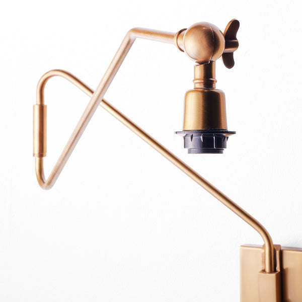 Cooper Wall fixture in antiqued Brass