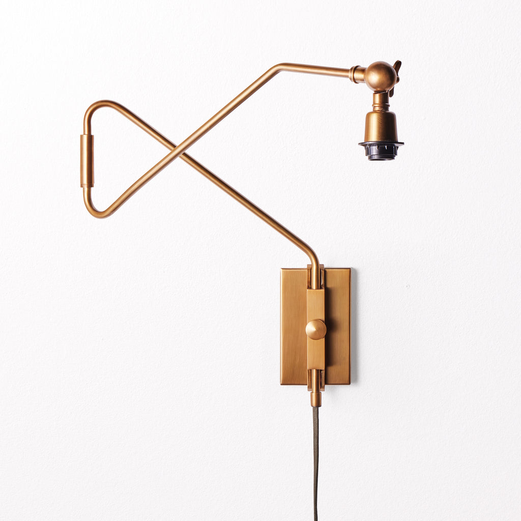 Cooper Wall fixture in antiqued Brass