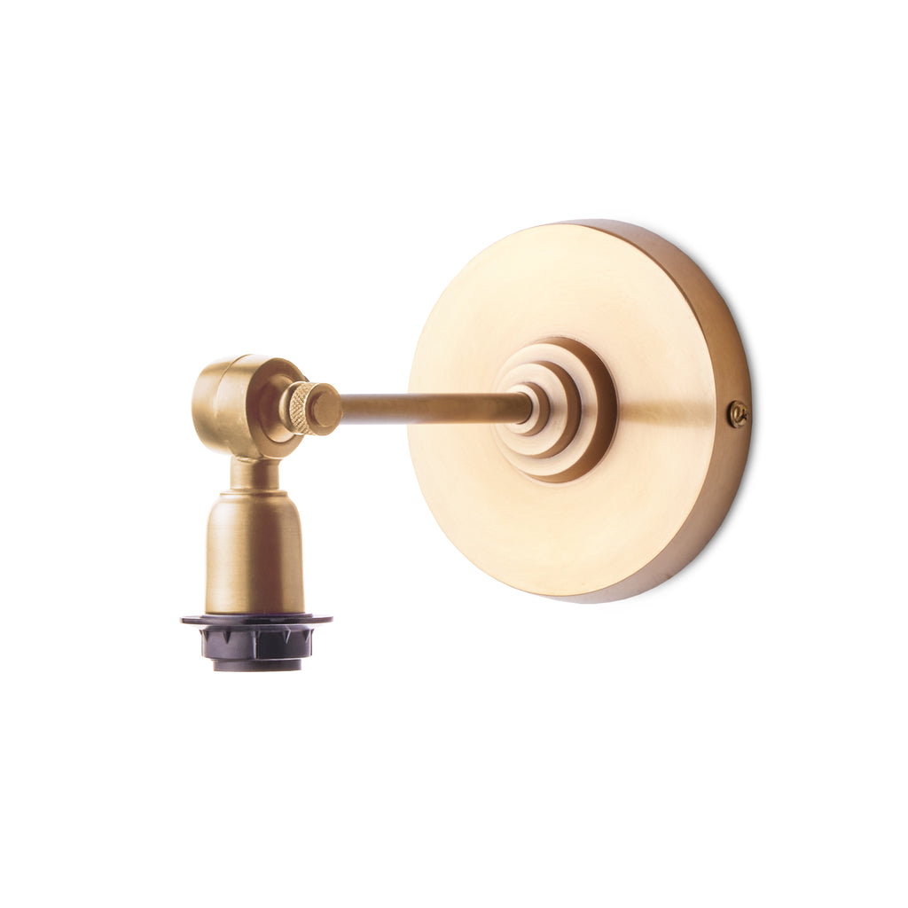 Elbow wall fixture in antiqued brass