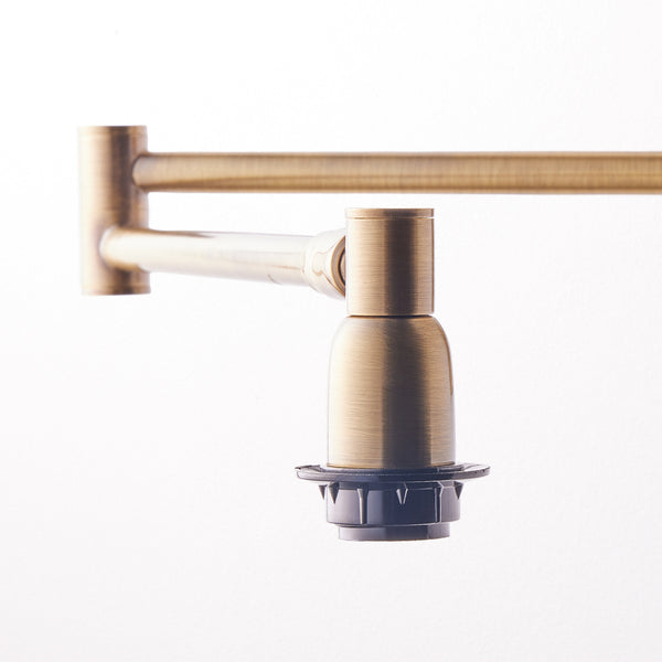 Lacey Wall fixture in antiqued brass