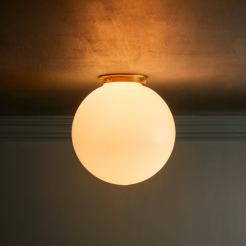 Larger Plumb flush mount fixture in antiqued brass Larger Plumb flush mount fixture in antiqued brass