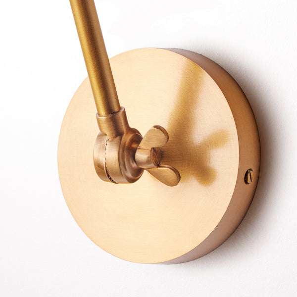 Stork wall fixture in antiqued brass