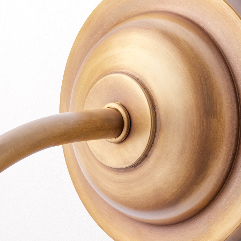 Bathroom Swan neck wall fixture in antiqued brass finish