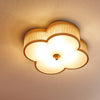 Clover flush mount ceiling light in antiqued brass with glass rods