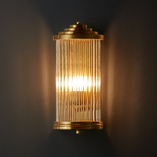 Baby Roddy wall sconce in antiqued brass