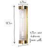 Long Roddy wall sconce in antiqued brass with glass rods