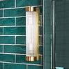 Long Roddy wall sconce in antiqued brass with glass rods
