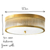 Round Roddy flush mount ceiling light in antiqued brass and clear glas