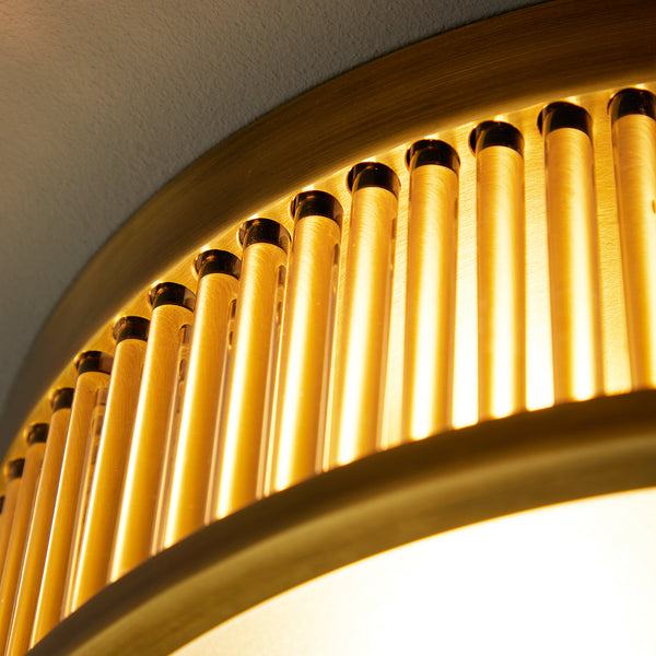Round Roddy flush mount ceiling light in antiqued brass and clear glas