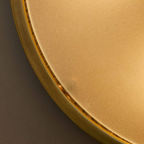 Round Roddy flush mount ceiling light in antiqued brass and clear glas