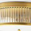 Round Roddy flush mount ceiling light in antiqued brass and clear glas