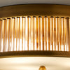 Round Roddy flush mount ceiling light in antiqued brass and clear glas