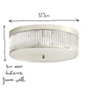 Round Roddy flush mount ceiling light in nickel and clear glass