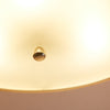 Round Roddy flush mount ceiling light in nickel and clear glass