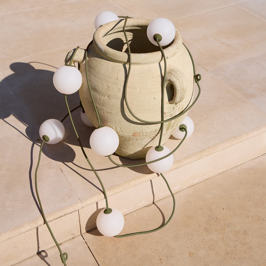 Heidi solar string lights in moss by the Novogratz