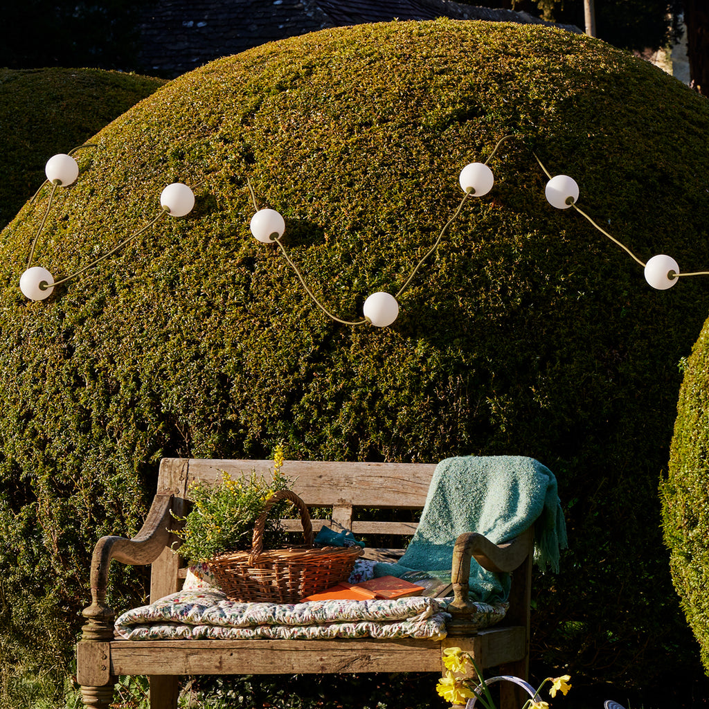 Heidi solar string lights in moss by the Novogratz