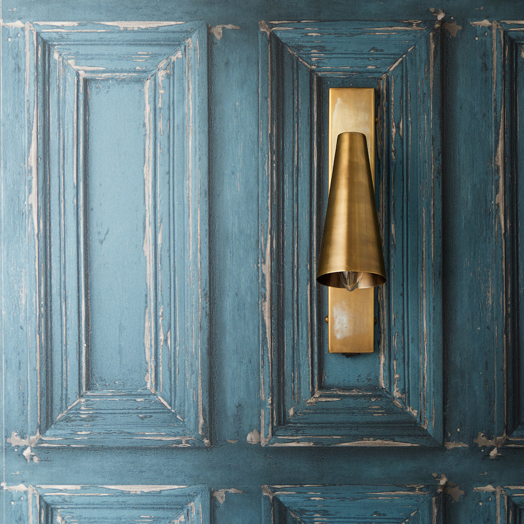 Victor wall sconce in antiqued brass