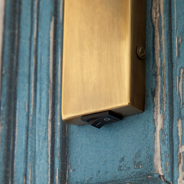 Victor wall sconce in antiqued brass