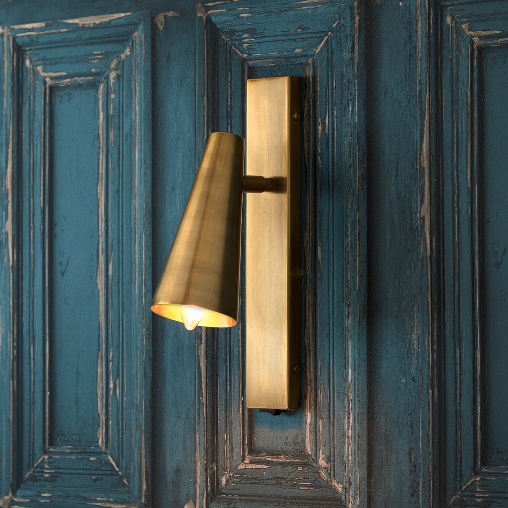 Victor wall sconce in antiqued brass