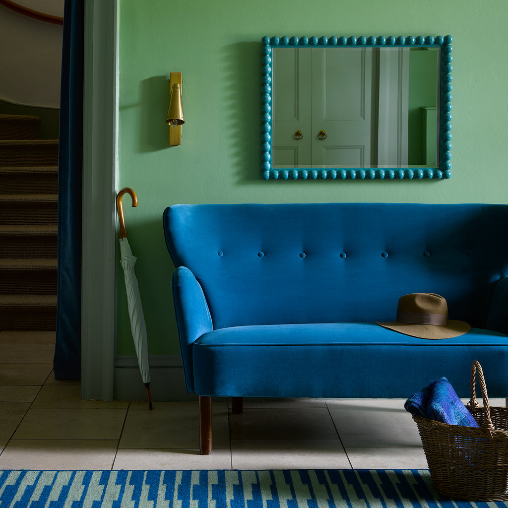 Victor wall sconce in antiqued brass