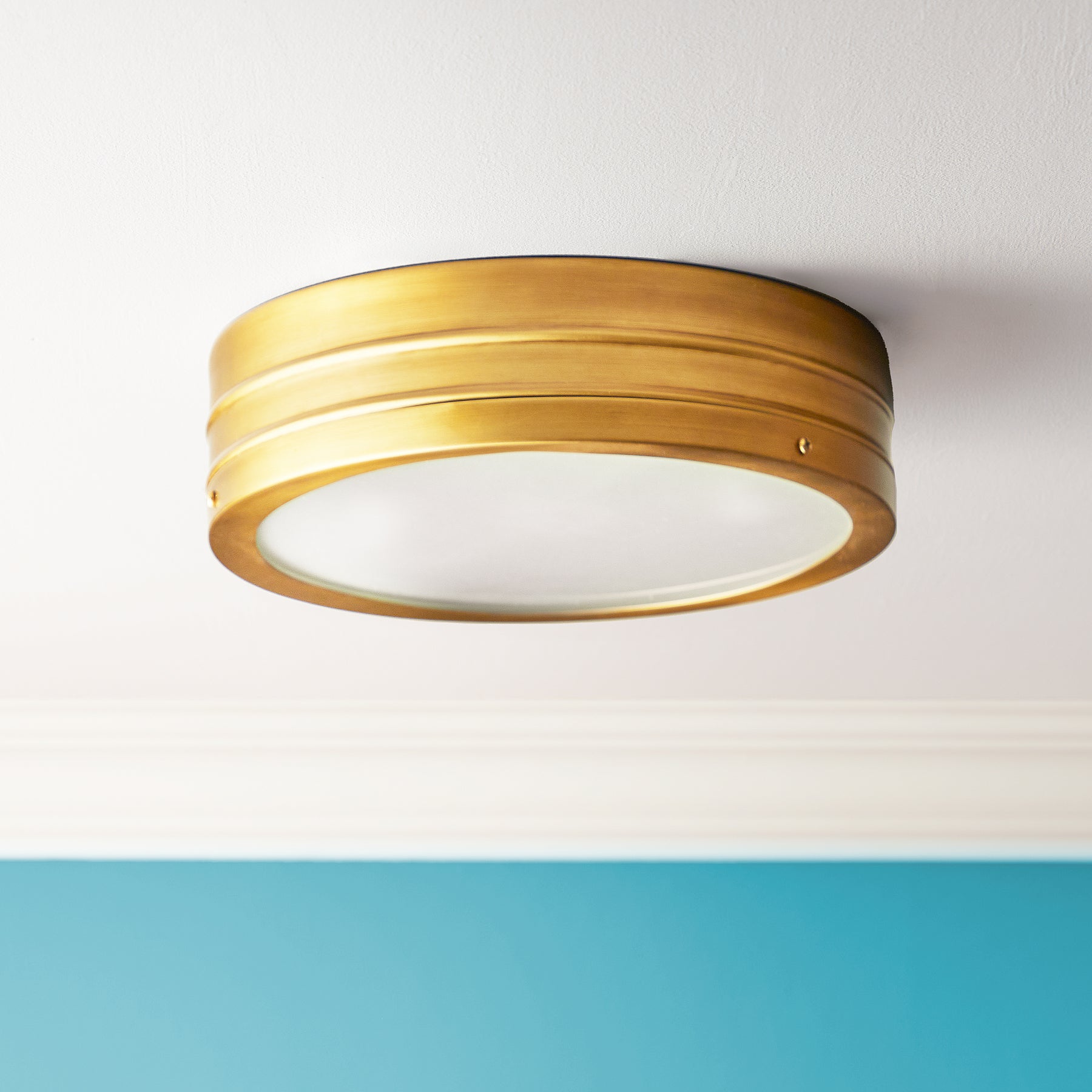 Wisteria flush ceiling mount light in antiqued brass and frosted glass